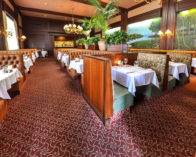 Step into a dining room where time slows down – rich wood paneling, white tablecloths, and leather booths create the perfect stage for beef-centered drama.