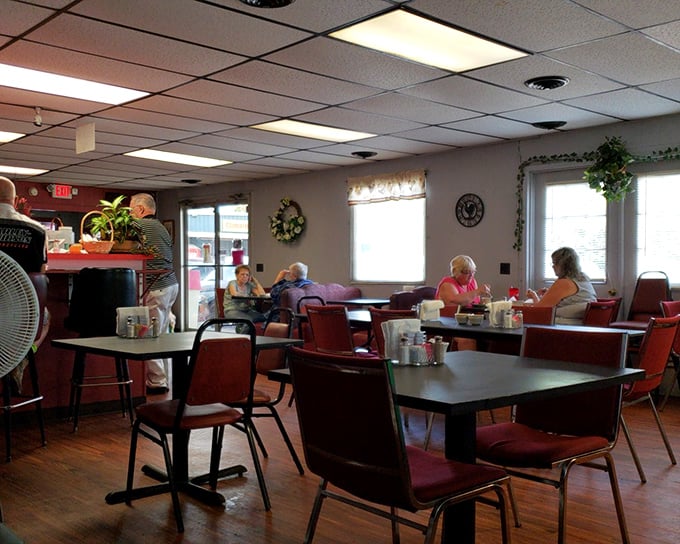 Inside, time slows down as red chairs invite you to settle in. This isn't Instagram-bait décor; it's the real deal where conversations matter more than selfies. 