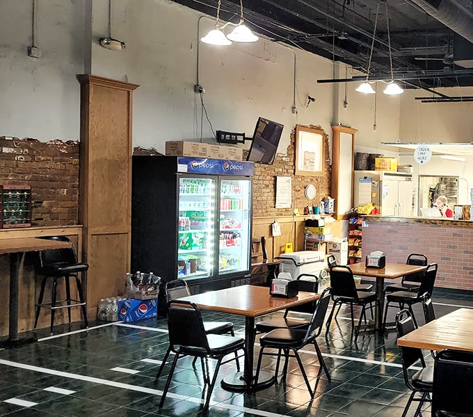 Inside, simplicity reigns supreme. Exposed brick walls and no-nonsense tables tell you immediately: this place prioritizes pizza perfection over pretentious décor.
