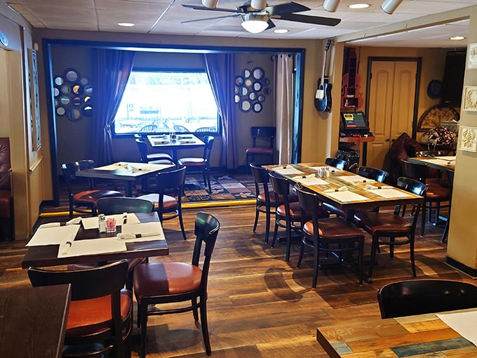 Step inside to a dining room that feels like a warm embrace—wooden tables, decorative plates, and that unmistakable neighborhood restaurant charm.