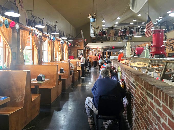 Wooden booths line the walls as patrons queue up for culinary treasures. The anticipation in this line is thicker than gravy on biscuits.