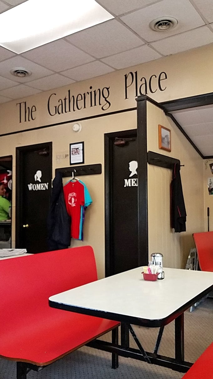 The Gathering Place isn't just a sign—it's truth in advertising. Red booths invite you to settle in for conversation that flows as freely as the coffee.