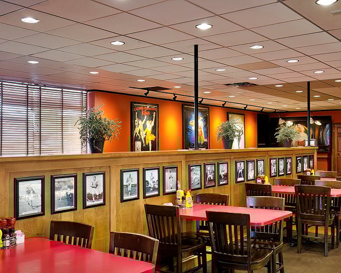 Warm wood paneling, vintage photographs, and those signature red tables create the perfect backdrop for the food memories you're about to make.