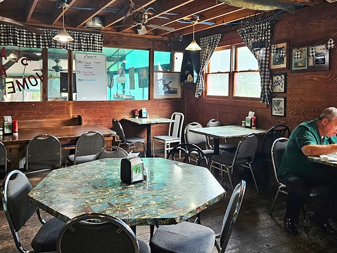 Wood-paneled walls, checkered curtains, and tables that have hosted countless conversations—this is comfort before it was trendy.