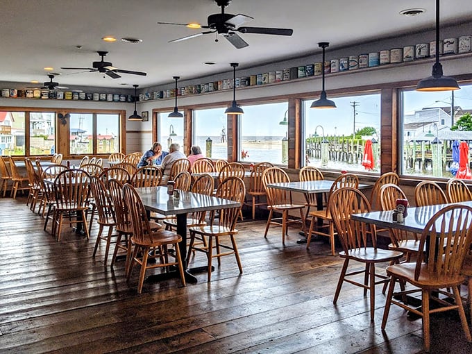 Inside, wooden chairs and wide windows create that classic coastal vibe where good food meets even better views of the marina.