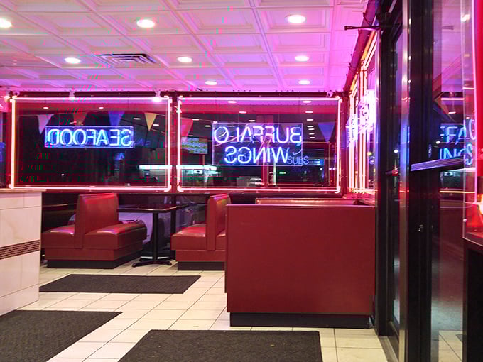 Red booths and neon signs create that perfect no-frills atmosphere where the food, not the decor, does all the talking.