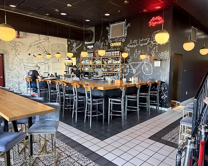 Whimsical chalk art maps and warm globe lighting create an atmosphere that's both sophisticated and welcoming—the perfect backdrop for Basque-inspired revelations.