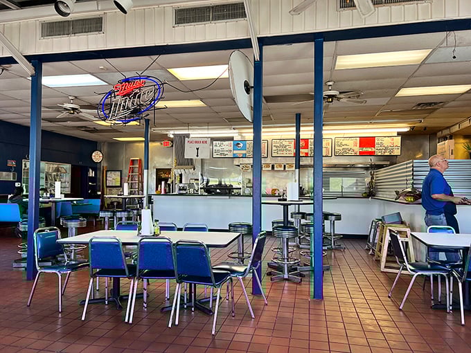 Blue chairs and simple tables set the stage for culinary magic. In the restaurant world, this is what we call "focusing on the important stuff."