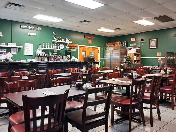 Green walls and wooden furniture create that "grandma's dining room" vibe where calories don't count and coffee refills are practically mandatory.