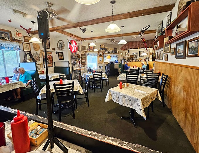 Step inside and you've entered a time capsule of comfort—where every framed photo, wooden beam, and checkered tablecloth tells a story of meals shared.
