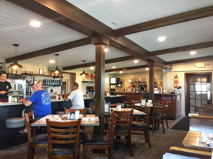Wooden beams, warm lighting, and that counter where regulars have probably solved all of life's problems over bottomless coffee cups.