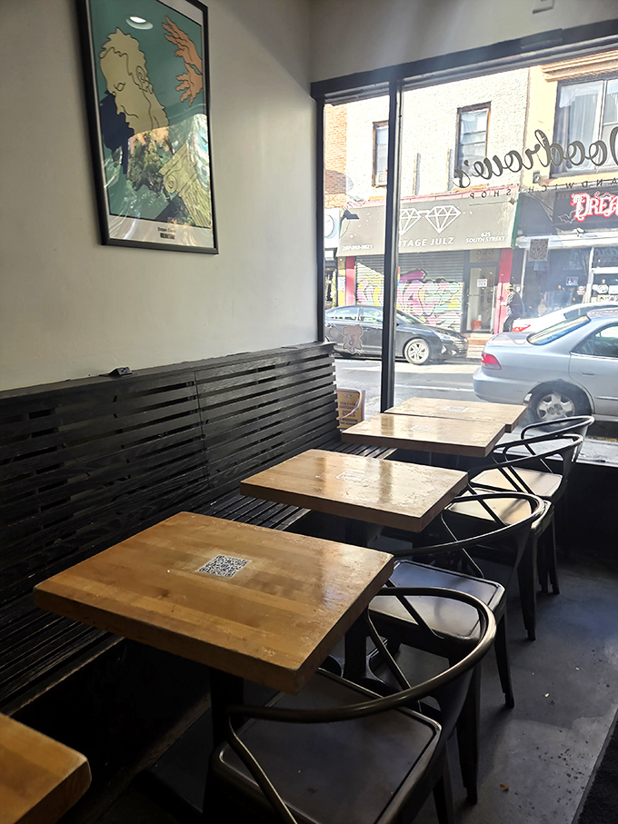 Minimalist chic meets sandwich perfection inside Woodrow's, where wooden tables and modern design create the perfect backdrop for culinary magic.