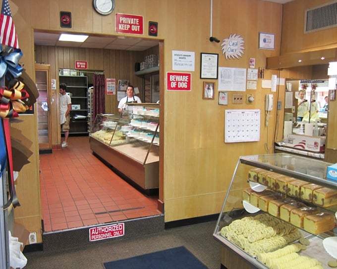 Step inside and time stands still—wood paneling, glass cases, and that "BEWARE OF DOG" sign that's more charming than threatening.
