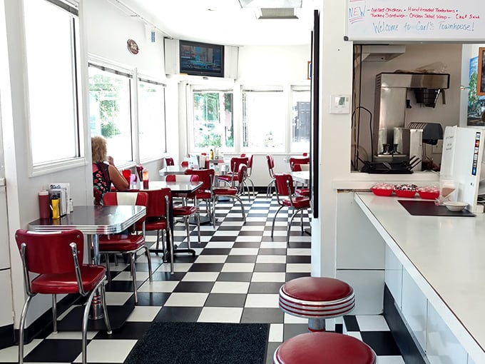 Classic Americana in every corner—red vinyl, chrome edges, and a checkered floor that's hosted countless conversations and comfort food.