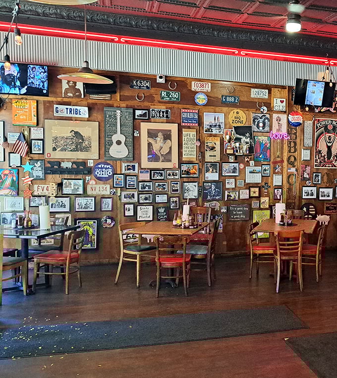 The wall of memorabilia creates a museum of Americana where every bite comes with a side of nostalgia. Spot the G-TRIBE license plate nodding to Cleveland's baseball heritage.