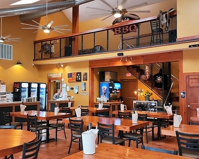 High ceilings, warm orange walls, and that inviting loft space create the perfect backdrop for the serious business of barbecue appreciation.