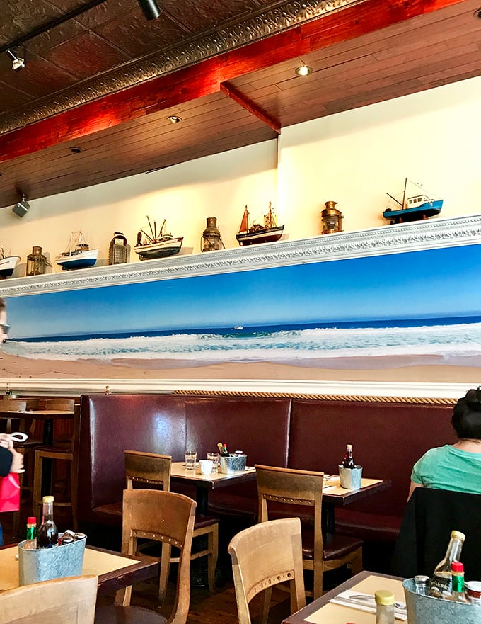 Maritime meets modern in this cozy dining room where model ships sail above leather booths, and that panoramic ocean view reminds you what's really on the menu.