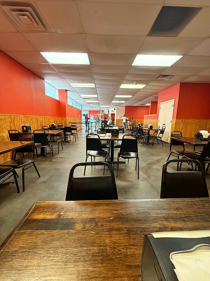 No-frills dining at its finest—coral walls and wooden tables create the perfect backdrop for the serious business of barbecue appreciation.
