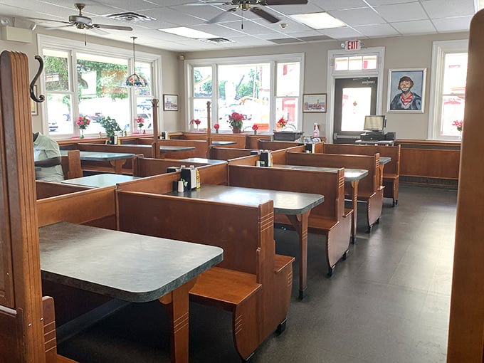 The classic diner setup promises no pretension, just honest food. Those red-and-white awnings aren't decorative choices—they're culinary bat signals.