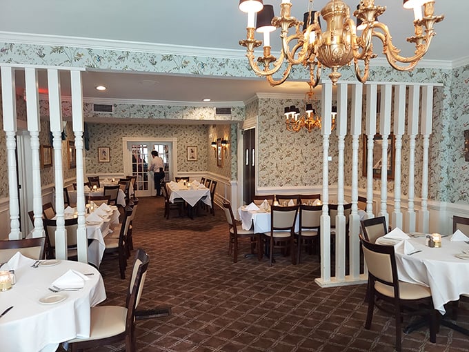 Those white columns and chandeliers create dining room magic that makes every meal feel like a special occasion worth celebrating.