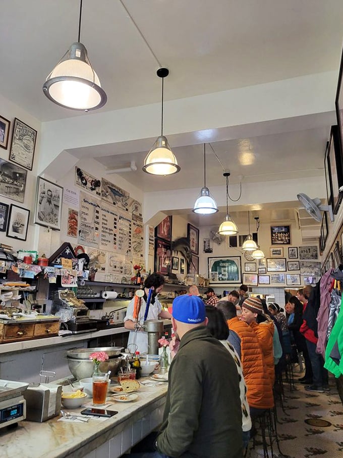 Inside, time stands still – a marble counter, 18 stools, and walls plastered with decades of memories. This isn't dining; it's a delicious history lesson.