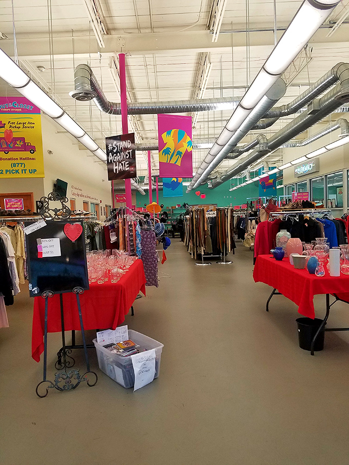 Inside, colorful banners and neatly organized racks create an atmosphere that's more boutique than typical thrift store chaos.