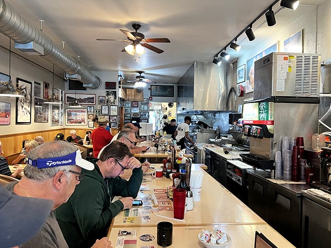 Counter seating where morning conversations flow as smoothly as the coffee, and every stranger becomes a temporary neighbor.