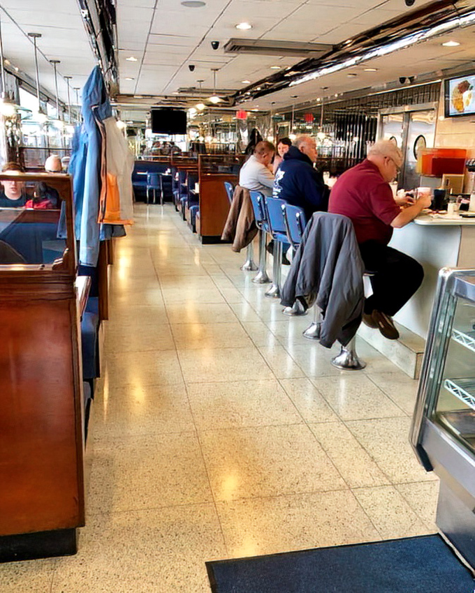 Where conversations flow as smoothly as the coffee—the counter seating at The American Diner offers front-row views to short-order magic in action.