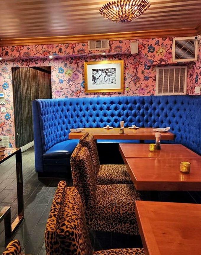 Blue velvet booths meet floral wallpaper and leopard print in a design mashup that somehow works perfectly. It's like your eccentric aunt's living room—if she were a culinary genius.