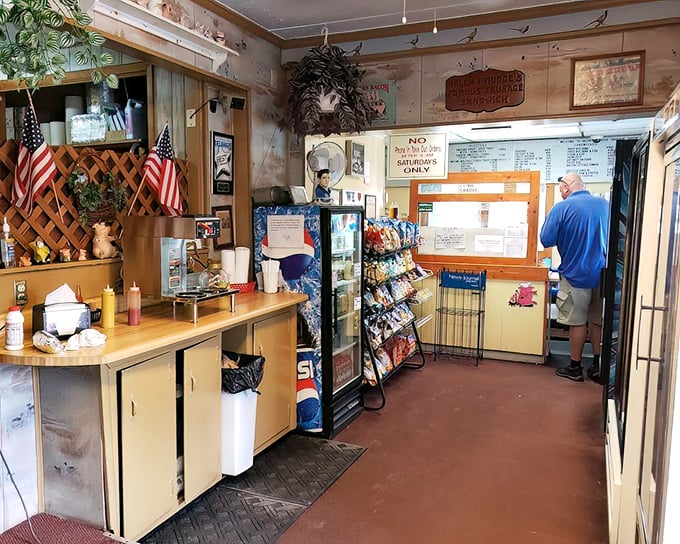 Step inside and you're transported to a simpler time – wood paneling, American flags, and the promise of hearty meals served without pretension.