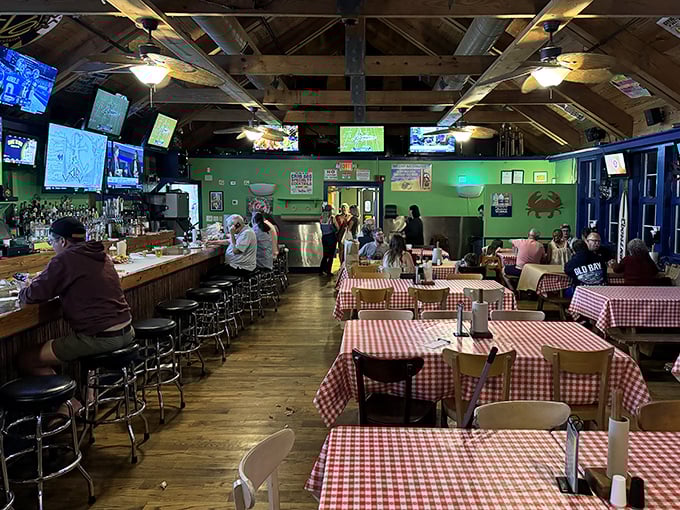 Classic red and white checkered tablecloths set the stage for the messy masterpiece about to unfold. No pretension here—just serious seafood business.