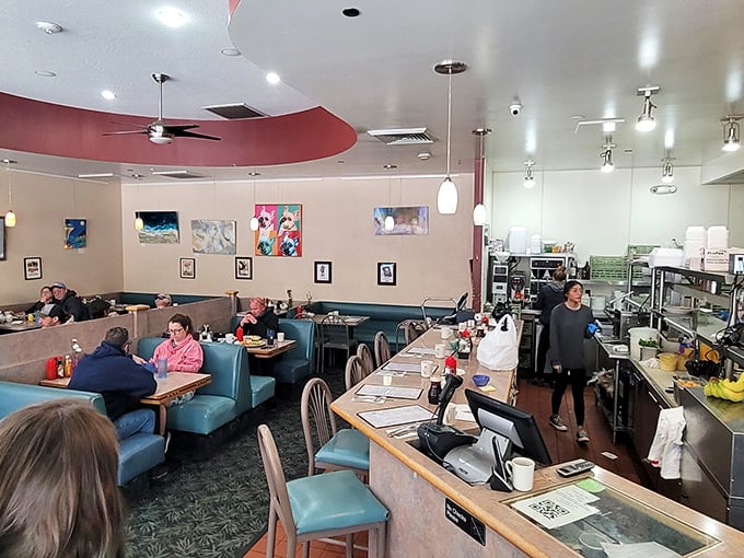 Inside, teal booths and local artwork create that perfect diner atmosphere—comfortable enough to linger, bustling enough to know you're somewhere special.