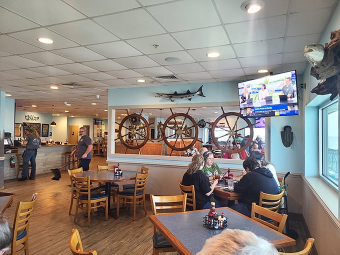 Ship wheels and mounted fish transform dining into a maritime adventure—like eating in the captain's quarters, but with better service.
