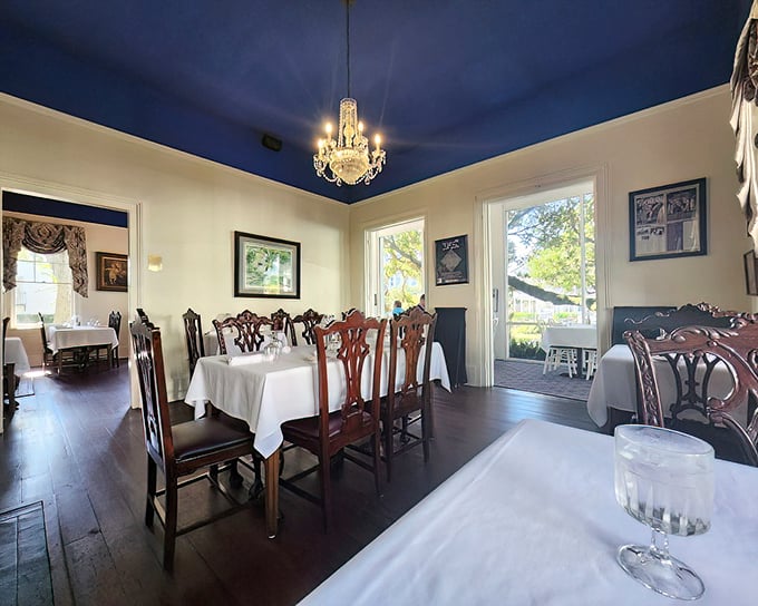 That royal blue ceiling isn't just gorgeous—Southern tradition says it keeps away spirits (though the spirits in your glass are always welcome).