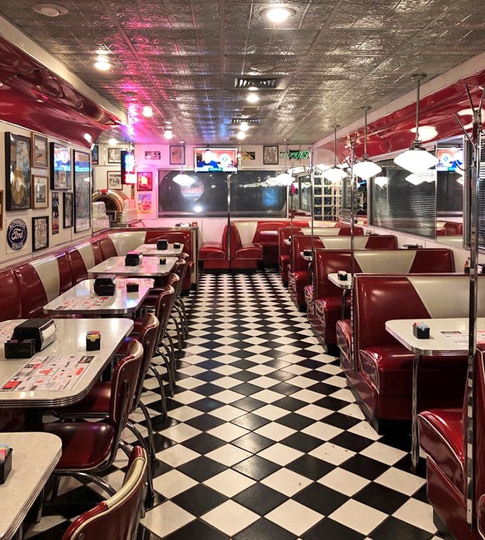 Red vinyl booths and checkerboard floors – not a movie set, but the real deal. This is where conversations happen between bites of comfort food.