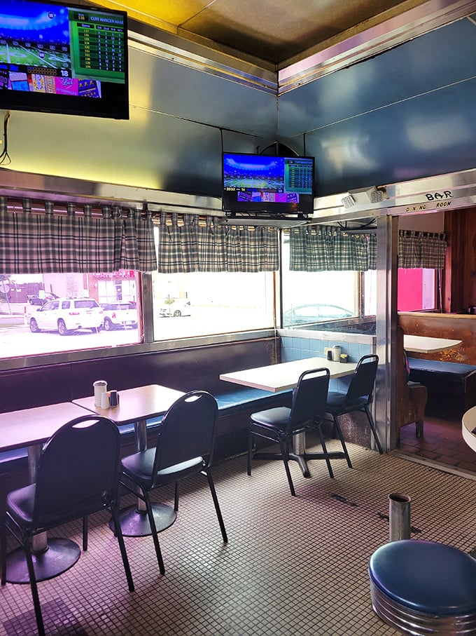 Plaid curtains, checkered floors, and TVs in the corner—this isn't retro by design, it's authentic by survival.