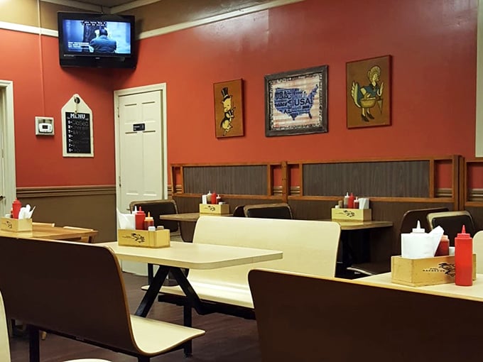 Simple booths, wood paneling, and walls the color of barbecue sauce – this isn't interior design, it's barbecue authenticity in its natural habitat.