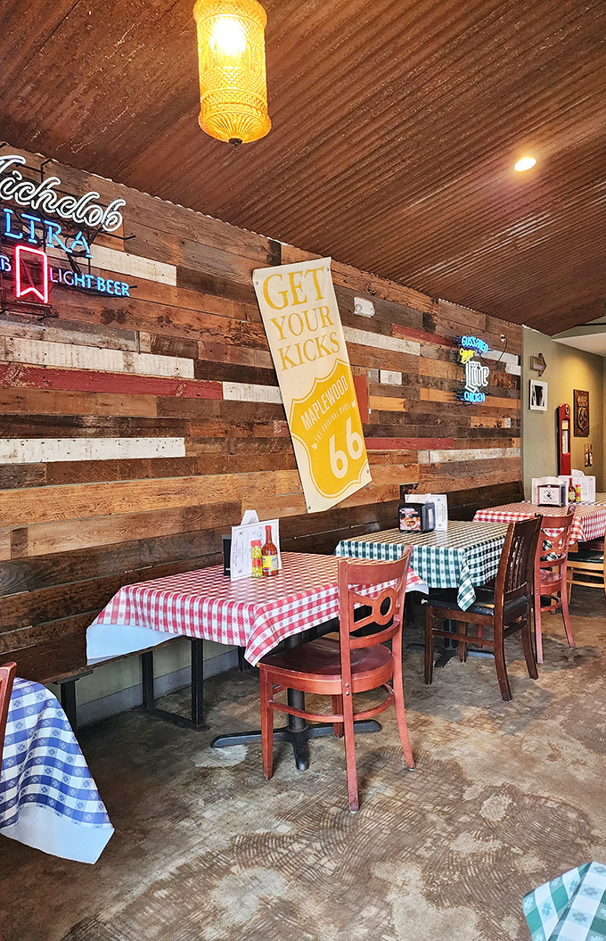 Reclaimed wood walls, checkered tablecloths, and that "Get Your Kicks" Route 66 banner – this isn't designer décor, it's authentic American comfort at its finest.
