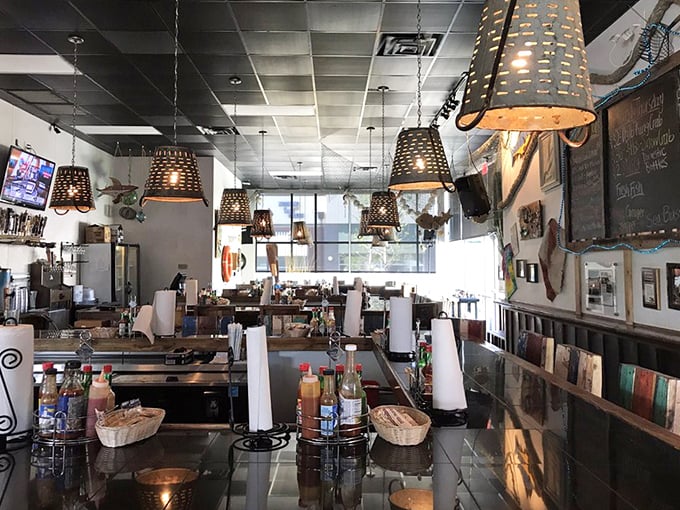The horseshoe bar isn't just clever design—it's theater-in-the-round where seafood becomes the star and shuckers are the supporting cast.