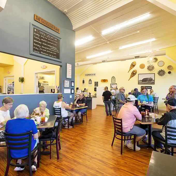 "The Gathering Place" indeed—warm wood floors and cheerful blue and yellow walls create the perfect backdrop for morning conversations.