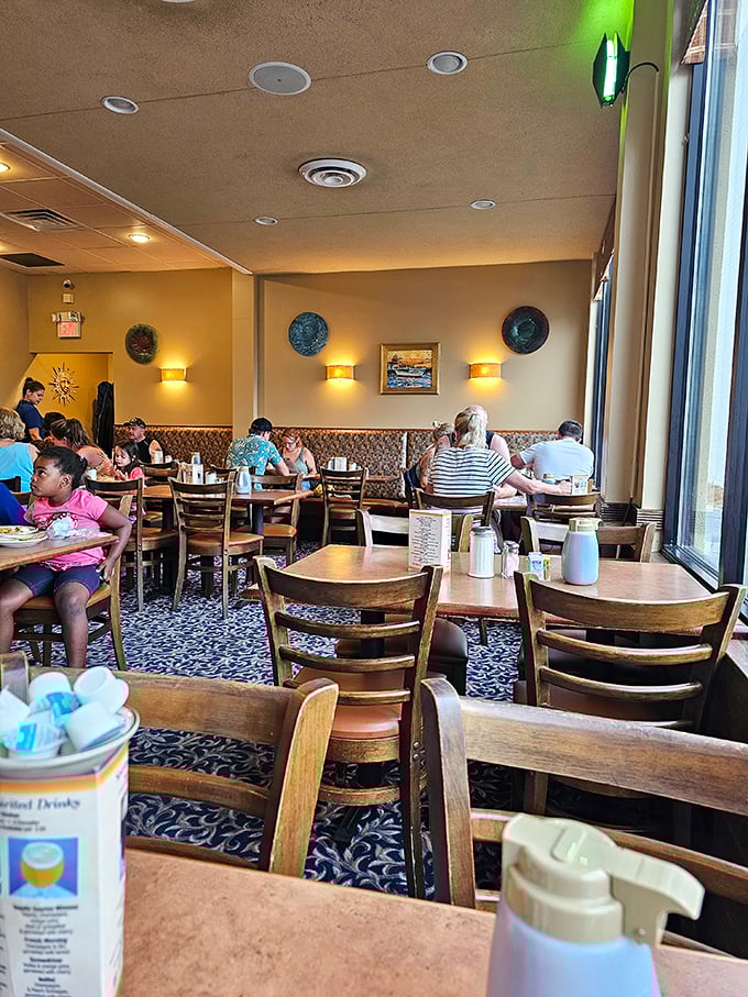 Inside, warm lighting and cozy booths create the perfect backdrop for morning conversations and coffee refills that never seem to end.