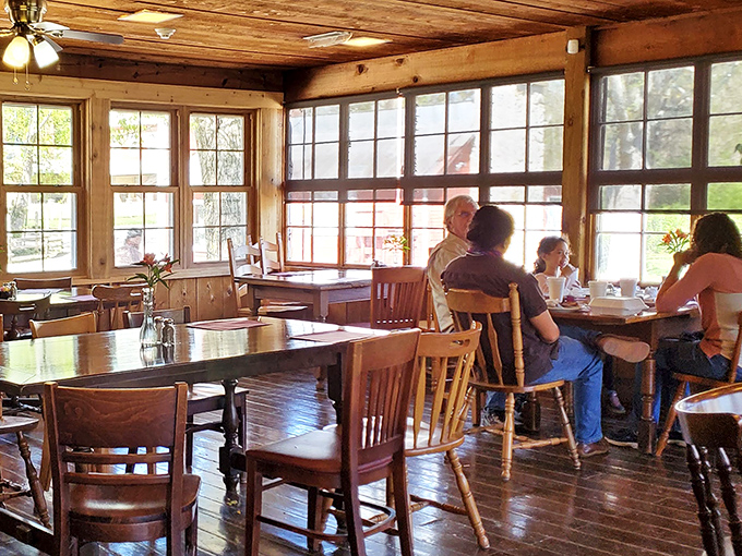 Sunlight streams through windows framing diners in a warm wooden embrace. This isn't just breakfast—it's morning theater with the best seats in Ohio.