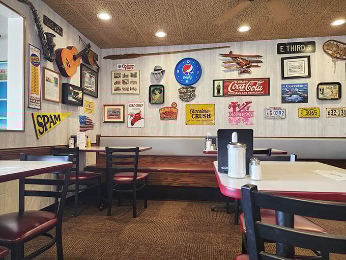 Vintage memorabilia and tin ceilings create an atmosphere that feels authentically nostalgic, not manufactured by some corporate design committee.