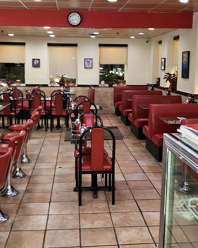 Classic red vinyl booths and gleaming tile floors—the diner's interior feels like stepping into a time when conversation mattered more than WiFi.