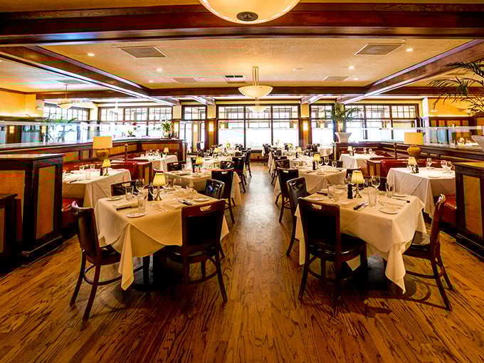 Classic steakhouse elegance that whispers, "Your jeans are fine, but your taste buds should dress up." Warm woods and white tablecloths set the stage.