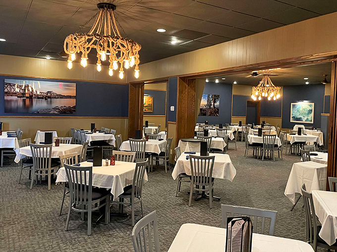White tablecloths and warm wood paneling create that perfect supper club atmosphere—elegant without pretension, fancy without fussiness.