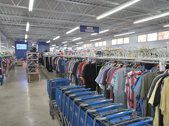 Organized chaos at its finest! Rows of color-coded clothing stretch toward the horizon, each rack a potential goldmine of fashion finds.