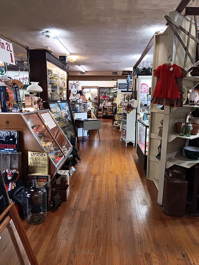 Polished wooden floors guide you through narrow passages of possibility, where each booth offers its own universe of collectibles waiting to be discovered. 