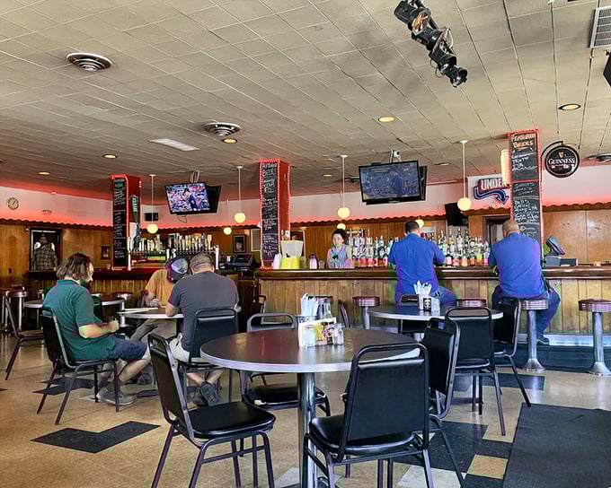 Where hot dog dreams come true. The classic bar setup, checkered floor, and wooden accents create the perfect backdrop for culinary adventures.