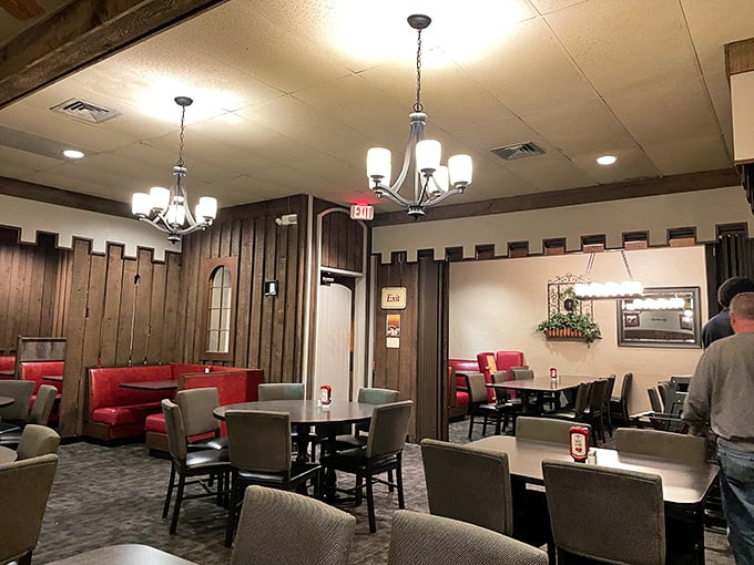Wood paneling and red vinyl booths transport you straight to 1975, when conversation trumped selfies and comfort outranked design trends.